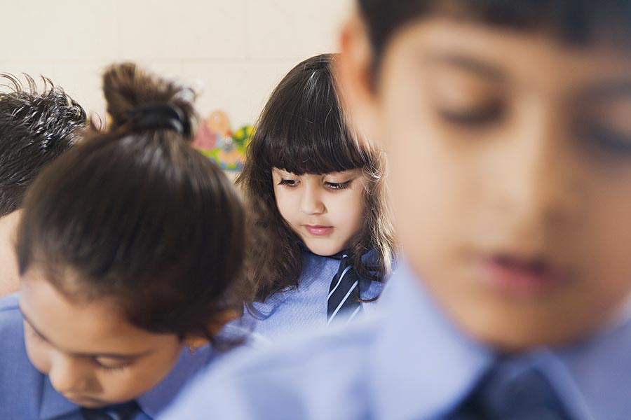 Close-up Indian Primary School Girl With Children Students Studying ...