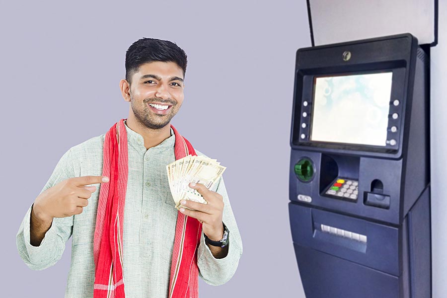Indian Rural man Showing Rupee Notes- ATM Machine Withdraw Money