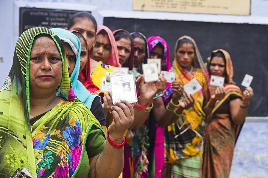 voting queue at election polling station uttar pradesh India
