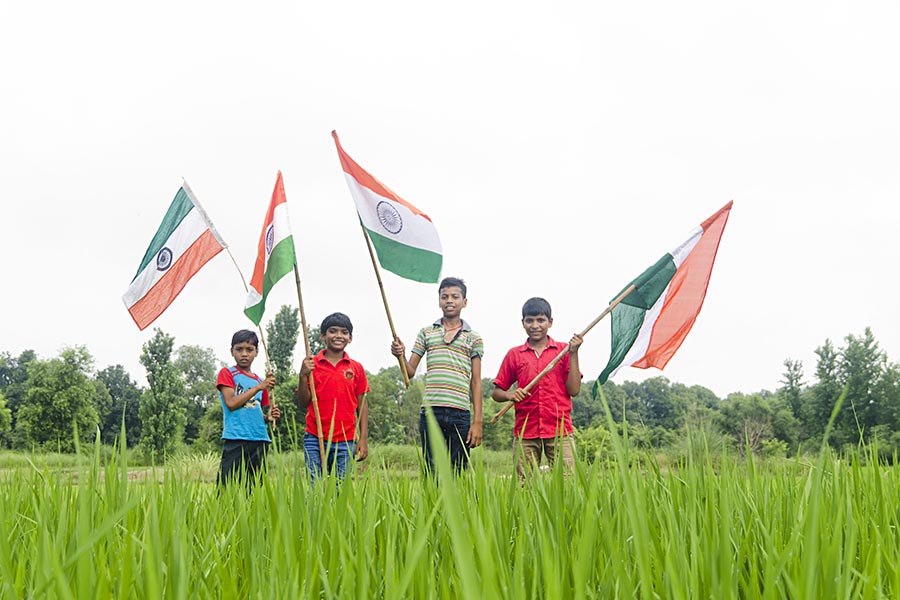 Four Rural Kids Boys Friends Holding Indian flag Standing in-Farm Happy ...