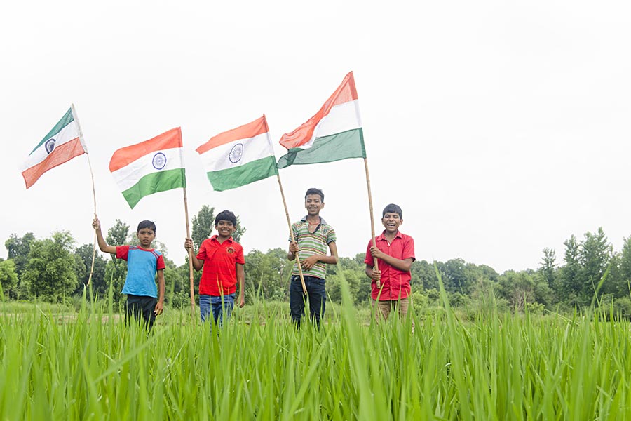Four Rural Childrens-Boys Friends Holding Indian-flag Standing in-Field ...