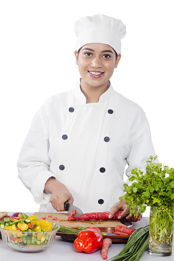 Professional Indian Woman Chef Cook Cutting Carrot Vegetables In ...