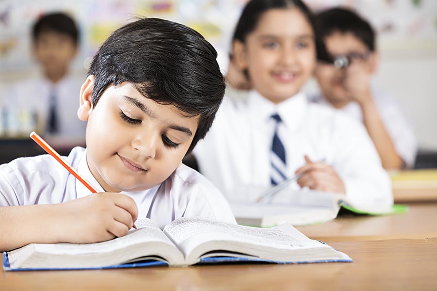 Indian Students Studying In Classroom