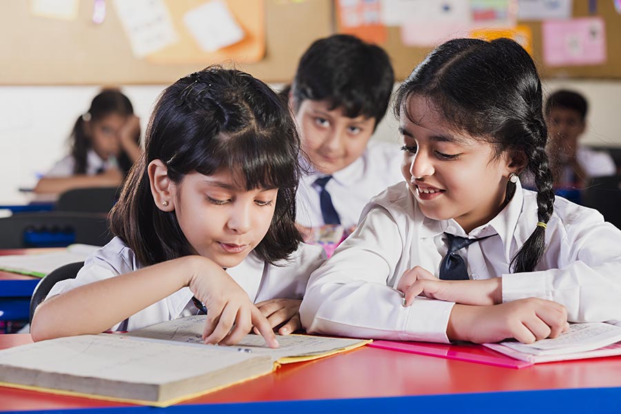 Indian School Kids Friend Students Studying Reading Book Education In ...