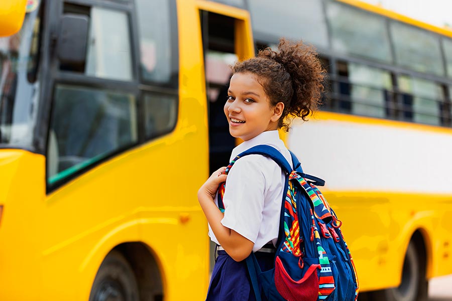 Side-View Schoolgirl Student Carrying School-bag standing-in-Outside ...